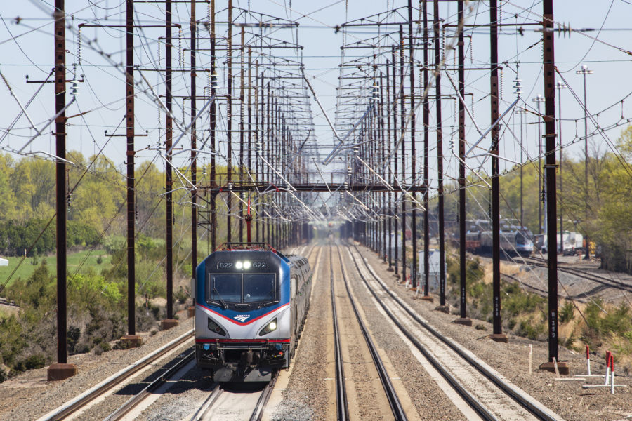 Linemen of the Electric Traction team work from a Catenary Car in New ...
